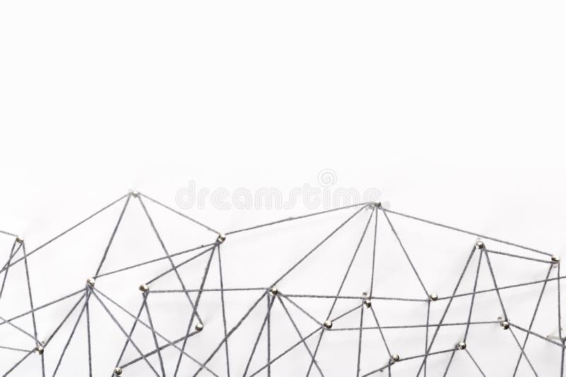 A Large Grid of Pins Connected with String. Communication, NetwA Large ...