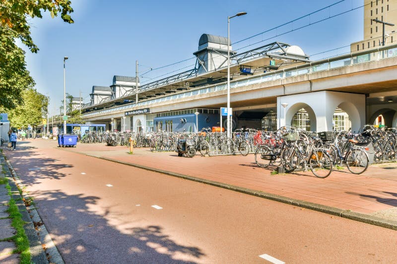 A Large Group of Bikes Parked Next To a Bridge Editorial Photo - Image ...