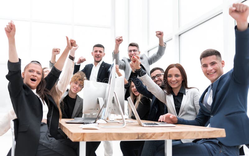 Large Group of Diverse Employees Celebrate while Sitting at a Table ...