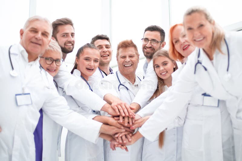 Large Group of Doctors Put Their Hands Together. Stock Image - Image of ...
