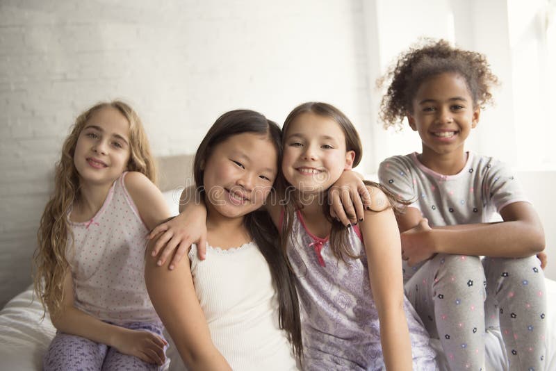 Large Group of Her Friends Taking Goog Time on Bed Stock Photo - Image ...
