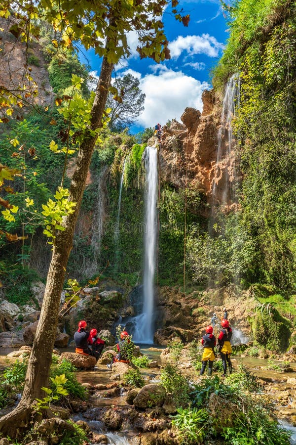 Large Group of People Enjoy Waterfall Descent Using Ropes Editorial ...