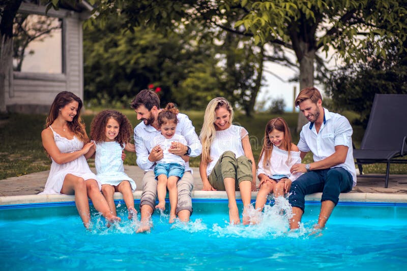 Group of People Sitting by the Swimming Pool Stock Photo - Image of ...