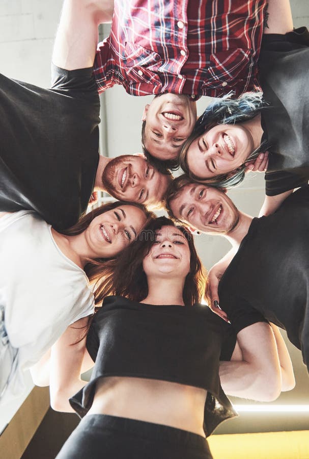 A Large Group of Smiling Friends Hugging Together. Stock Image - Image ...