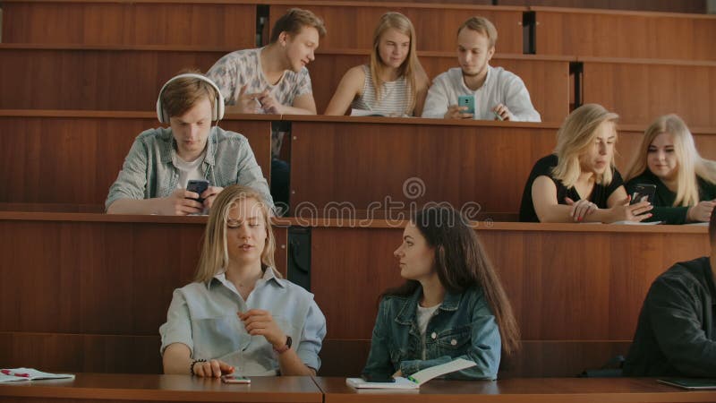 A Large Group of Students during the Break Communicate with Each Other ...