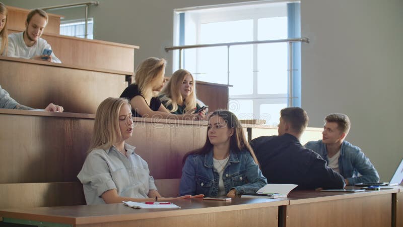 A Large Group of Students during the Break Communicate with Each Other ...