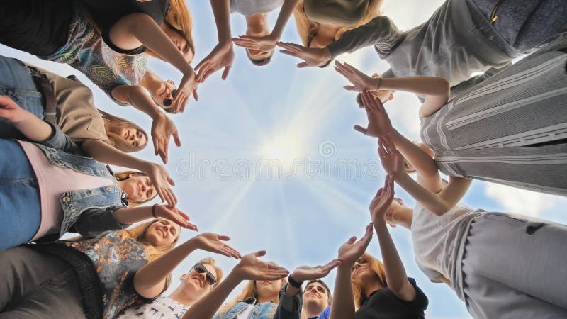 A Large Group of Students Makes a Circle Out of Their Hands. Stock ...