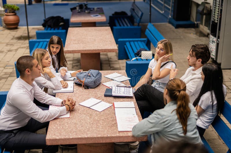 Large Group of Students Studying Together Gathered at Table in the ...