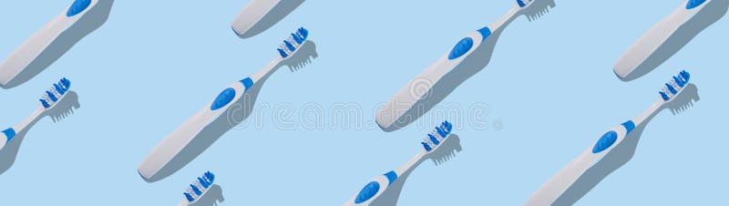 A Large Group of Toothbrushes Forming a Repeating Pattern on a Blue ...