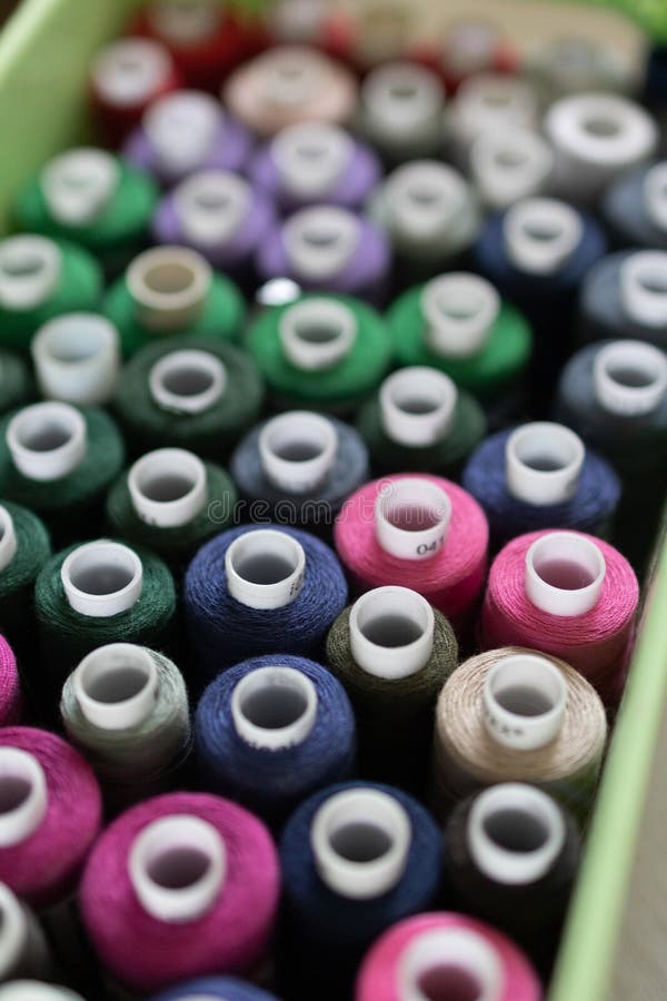 A Large Group of Various Colorful Spools of Thread for Sewing at the ...