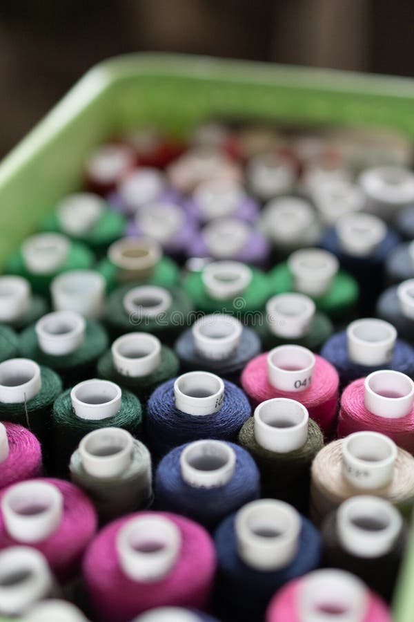 A Large Group of Various Colorful Spools of Thread for Sewing at the ...