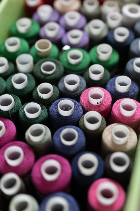 A Large Group of Various Colorful Spools of Thread for Sewing at the ...