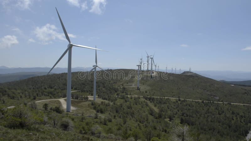 A Large Group of Wind Turbines are on a Hillside Stock Video - Video of ...
