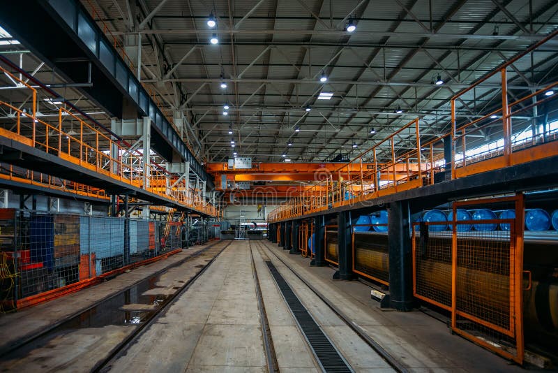 Freight Train with New Manufactured Pipes Exits from Warehouse Stock ...