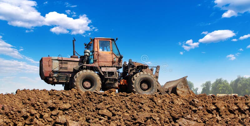 A Large, Heavy-duty Bulldozer on a Construction Site, Positioned on a ...