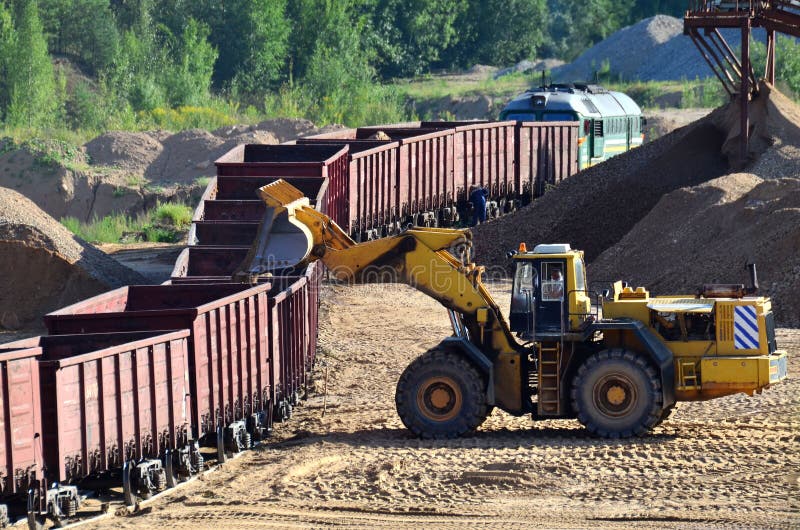 Large Heavy Front-end Loader Loading Sand it To the Freight Train ...