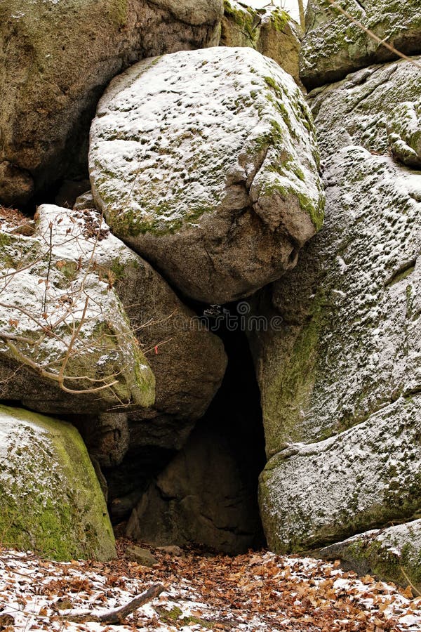 Small Cave Entrance Hole in the Moss Covered Rock Stock Photo - Image ...