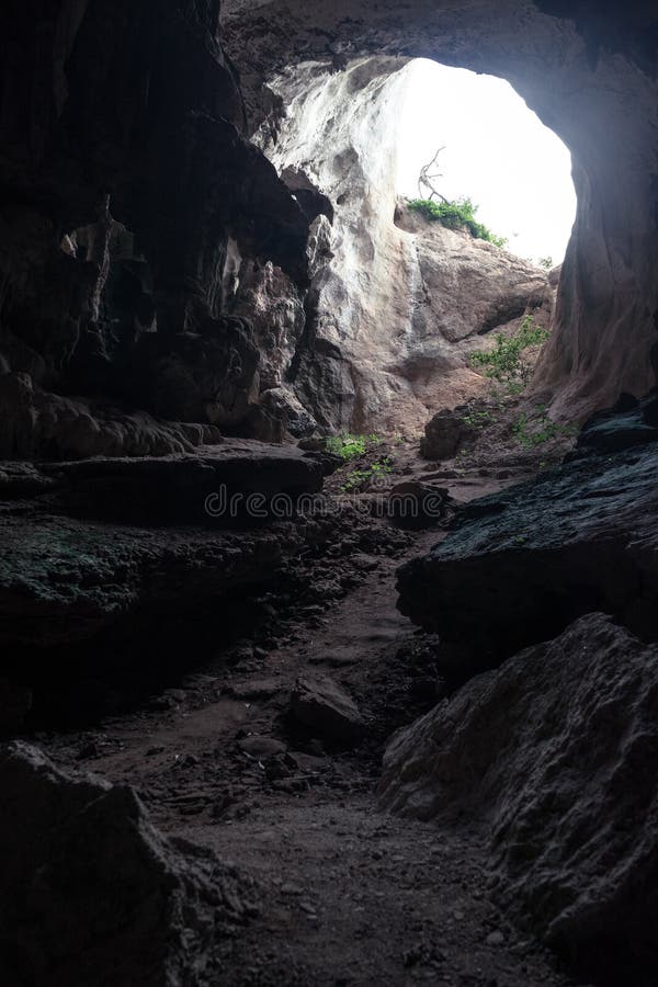 Large Hole in Dark Rocky Cave Stock Photo - Image of caving, exploring ...