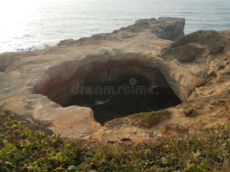 Large Hole in Cliff at Oregon Coast with Ocean and Waves Stock Image ...