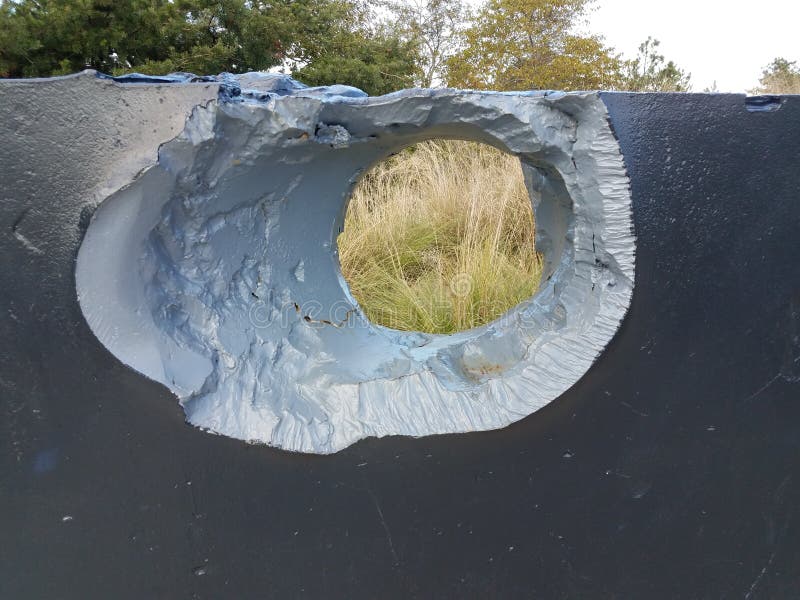 Large Hole or Damage in Metal Wall Outdoor Stock Image - Image of ...