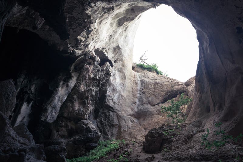 Large Hole in Dark Rocky Cave Stock Photo - Image of caving, exploring ...