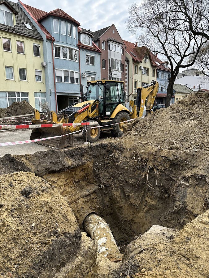 Large Hole with Pipeline at the Road Construction Site Stock Image ...