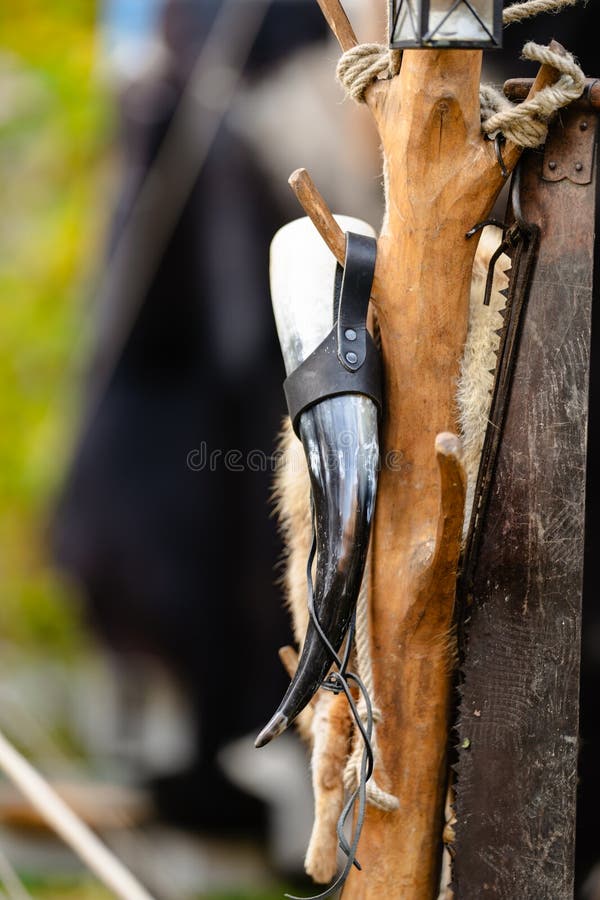 A Large Horn is Hanging from a Wooden Post Stock Image - Image of ...