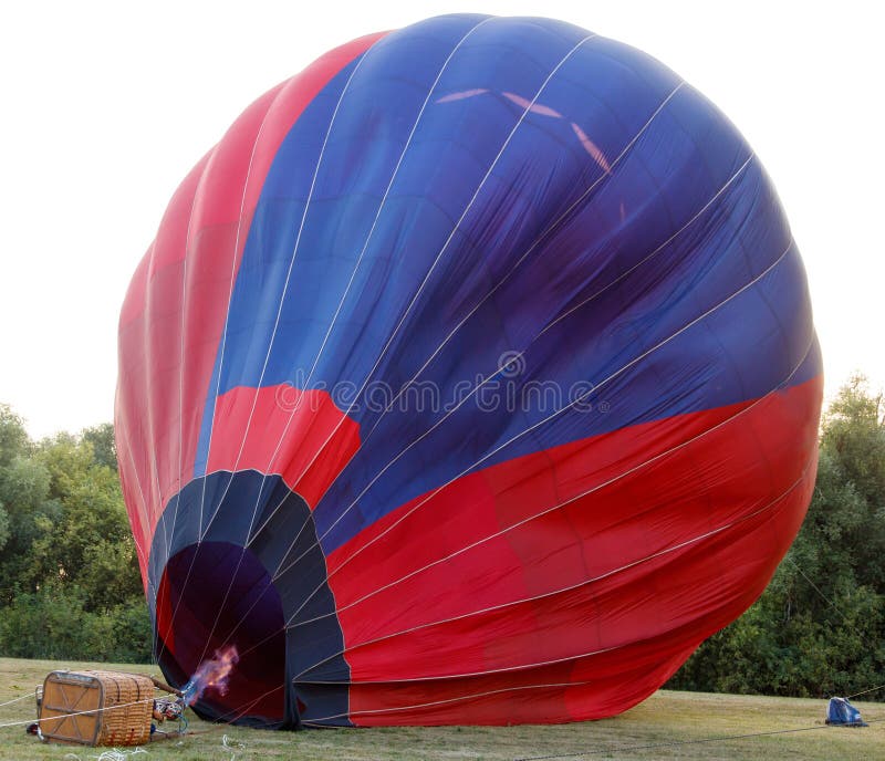 A Large Hot Air Balloon is Sitting on the Ground Stock Photo - Image of ...