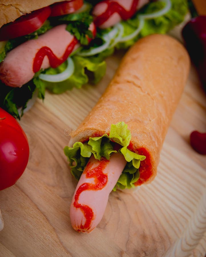 Large Hot Dog with Vegetables on the Table. Stock Photo - Image of ...
