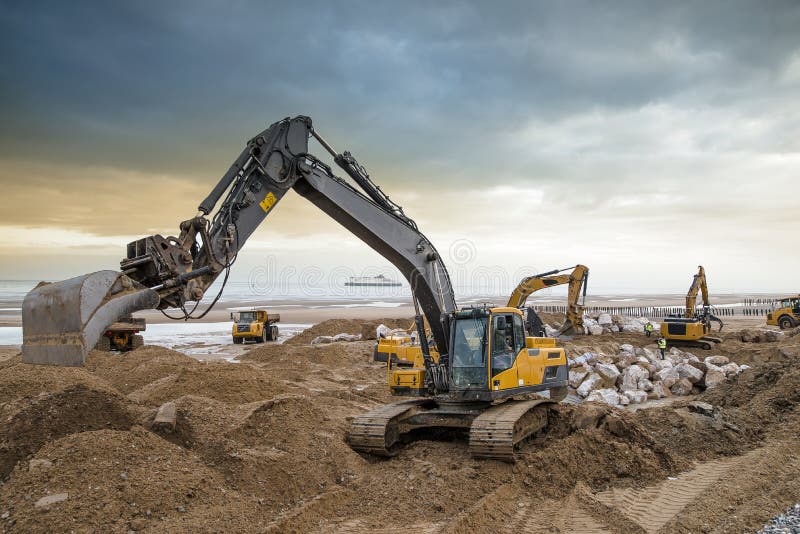 Large Hydraulic Excavators and Dumper Working As a Team on a ...