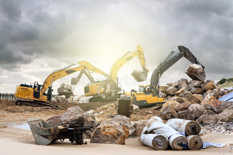 Large Hydraulic Excavators Working As a Team on a Construction Site ...
