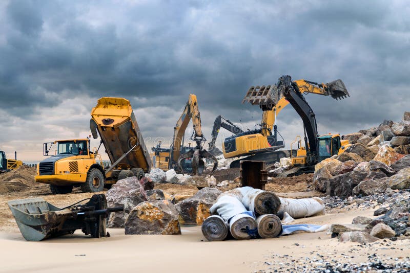 Large Hydraulic Excavators Working As a Team on a Construction Site ...