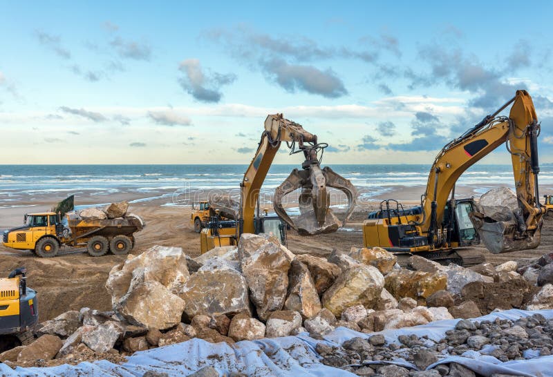 Large Hydraulic Excavators Working As a Team on a Construction Site ...