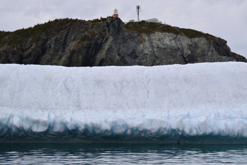 Large Iceberg at the Base of Cliff in Twillingate Harbour with Long ...