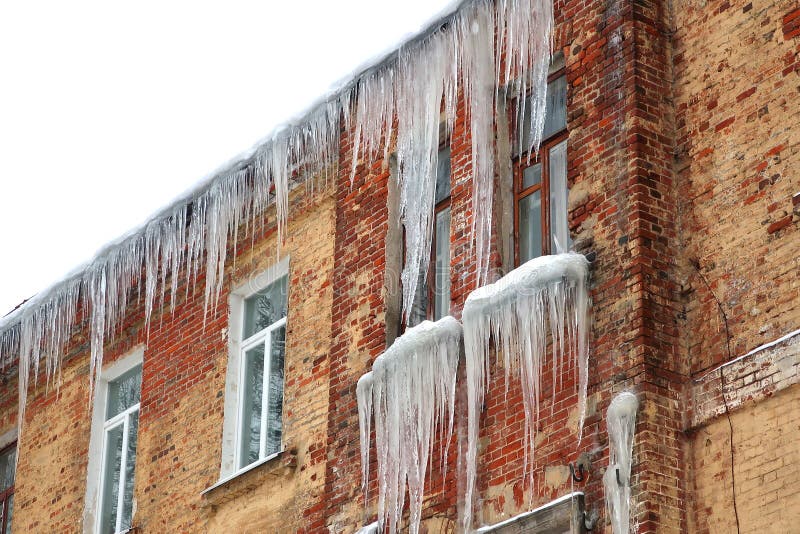 Large Icicles Hanging Off a Building with Lantern Stock Image - Image ...
