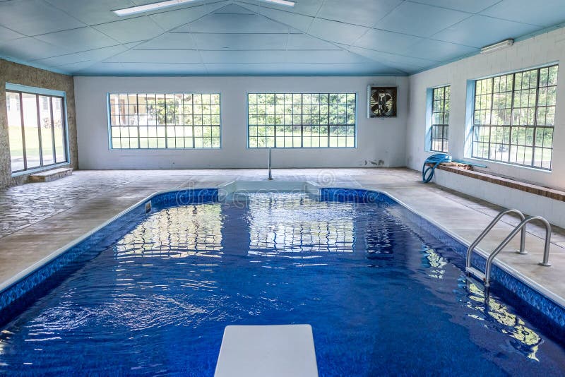 Large Indoor Pool with Lots of Natural Light from Large Windows in an ...