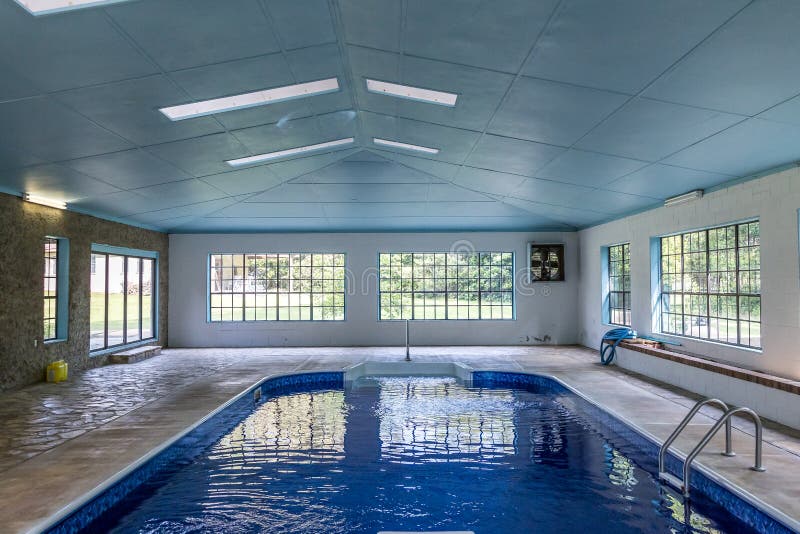 Large Indoor Pool with Lots of Natural Light from Large Windows in an ...