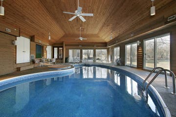 Large indoor swimming pool stock image. Image of house - 12662945