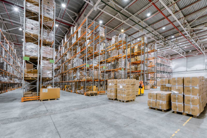 Large Industrial Warehouse. Many Cardboard Boxes Stand on a Loading ...