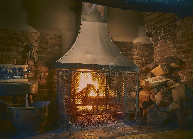 Large Inglenook Fireplace with Warm Fire and Wood Stack Stock Photo ...