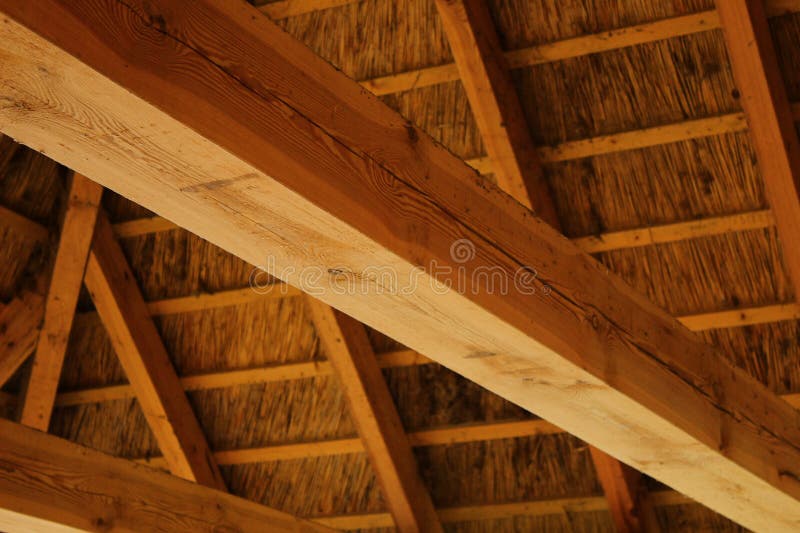 Large Interior Wooden Trusses in a Rustic Thatch Roof Structure Stock ...