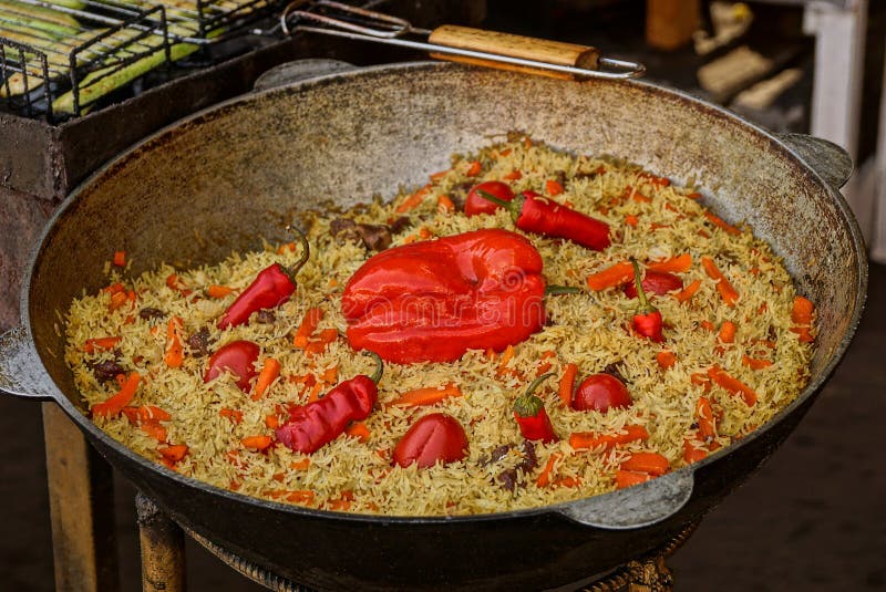 Pilaf from Rice Pieces of Meat and Vegetables in a Large Vat in the ...