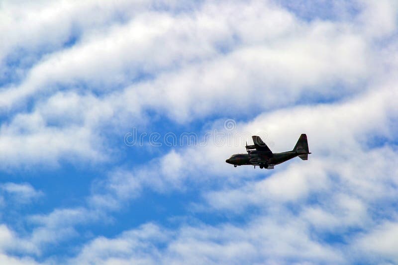 A Large Jet is Flying through a Cloudy Sky Stock Photo - Image of plane ...
