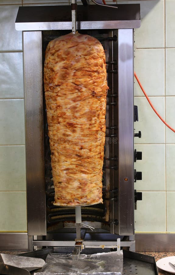 Large Kebab Skewer with Cooked Meat Going Around in the Shop Stock ...