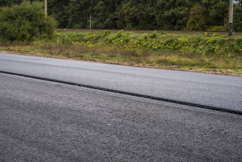 A Large Layer of Fresh Hot Asphalt. Layer of Asphalt Raw Material in a ...