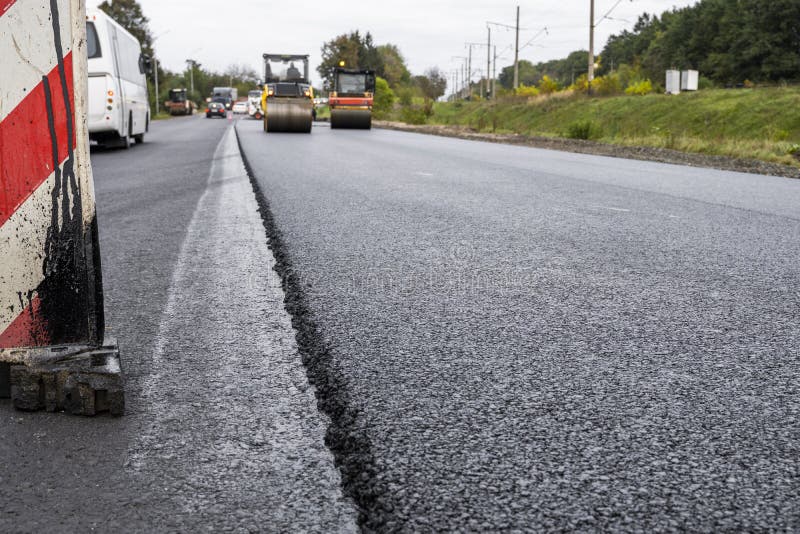 A Large Layer of Fresh Hot Asphalt. Layer of Asphalt Raw Material in a ...