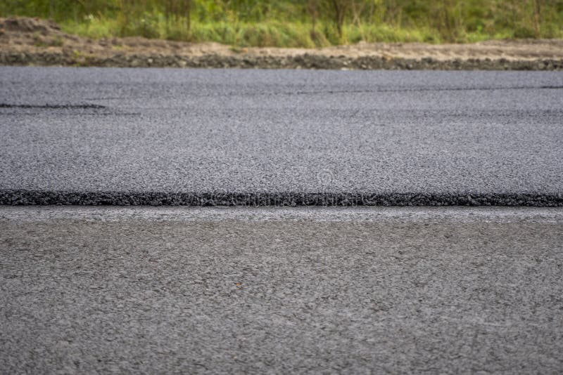 A Large Layer of Fresh Hot Asphalt. Layer of Asphalt Raw Material in a ...