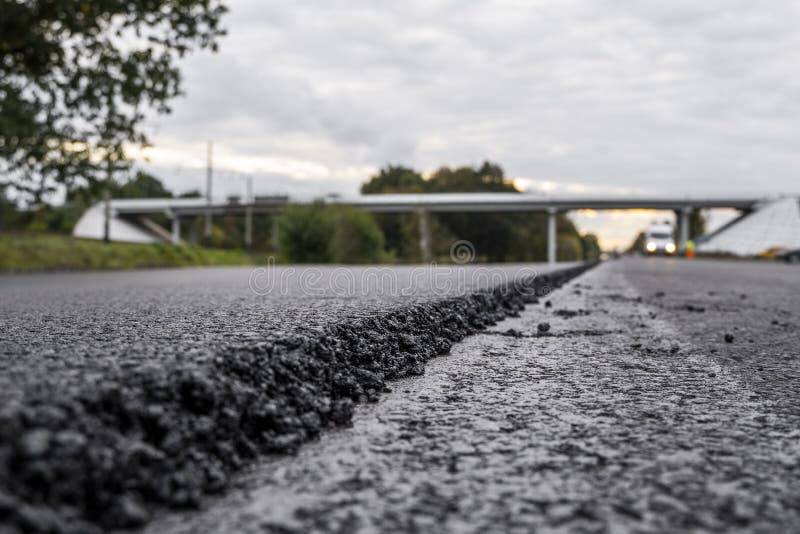 A Large Layer of Fresh Hot Asphalt. Layer of Asphalt Raw Material in a ...