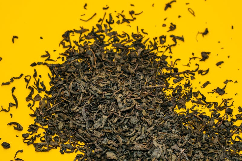 Large Leaf Green Tea Scattered on a Yellow Background. Close-up Stock ...