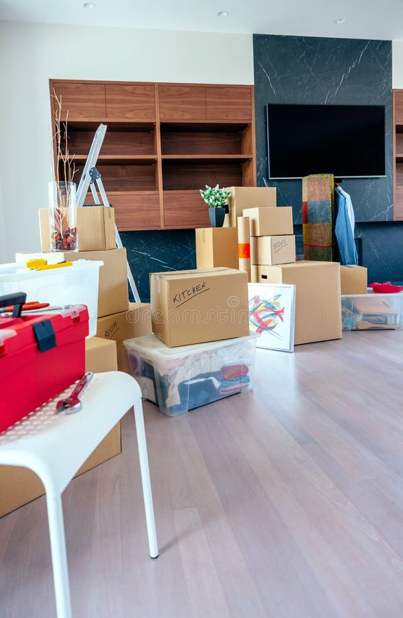 Living Room with Moving Boxes Stock Image - Image of boxes ...